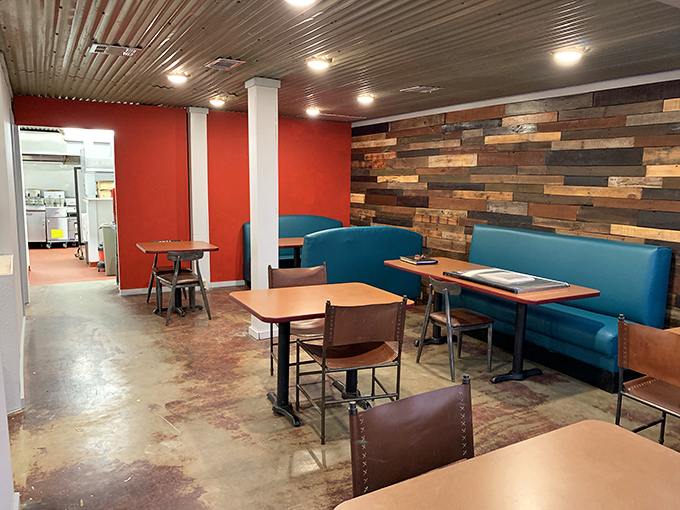 Inside, vibrant red walls meet rustic wood paneling, creating that perfect balance of warmth and character that chain restaurants spend millions trying to replicate.