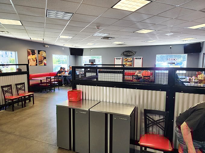 The interior balances nostalgic diner vibes with modern comfort&mdash;those red booths practically whisper, "Sit down, stay awhile, loosen that belt."