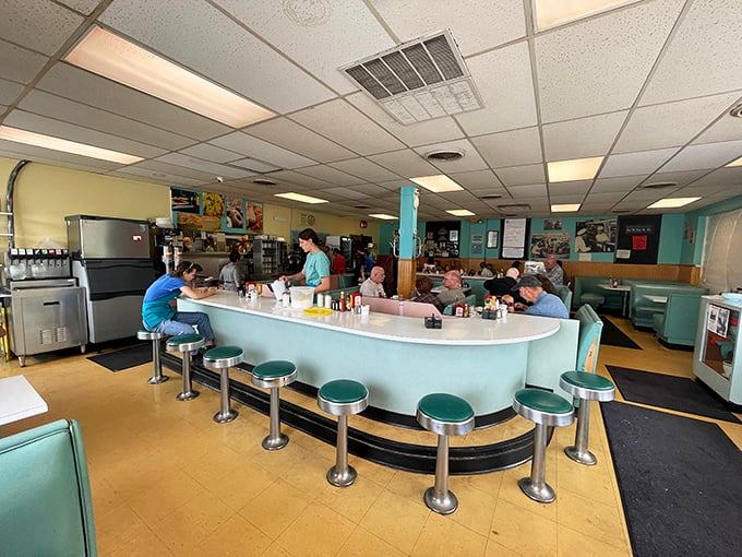 The mint-green counter with chrome stools isn't retro by design&mdash;it's authentic, having witnessed countless coffee refills and neighborhood conversations through the decades.