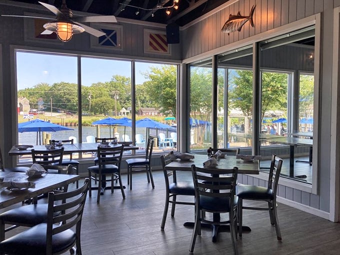 Floor-to-ceiling windows transform ordinary dining into waterfront theater, where every table offers front-row seats to the Wicomico River's gentle flow.