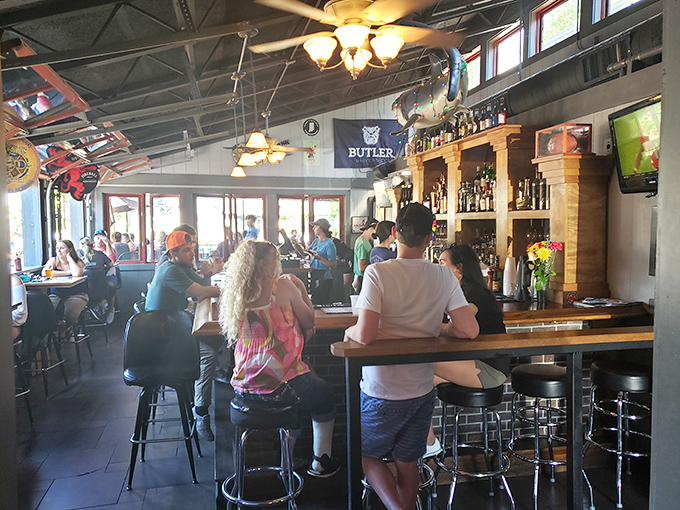 The bar buzzes with Hoosier hospitality, where Butler banners hang proudly and conversations flow as smoothly as the local craft beers.