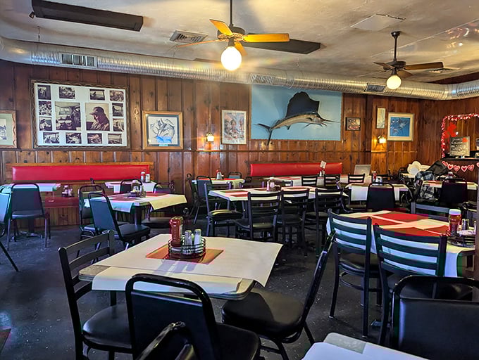 Wood paneling, mounted fish, and red-checkered tablecloths – this dining room hasn't changed in decades because perfection needs no updating.
