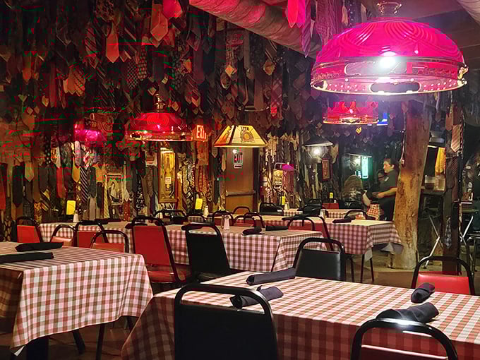 Inside, hundreds of sacrificed neckties dangle from above while the red checkered tablecloths set the stage for serious steak business.