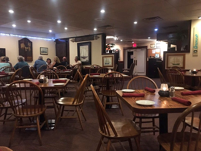 Classic Windsor-back chairs and nautical-themed artwork create that perfect "been-here-forever" ambiance that promises comfortable dining and zero pretension.