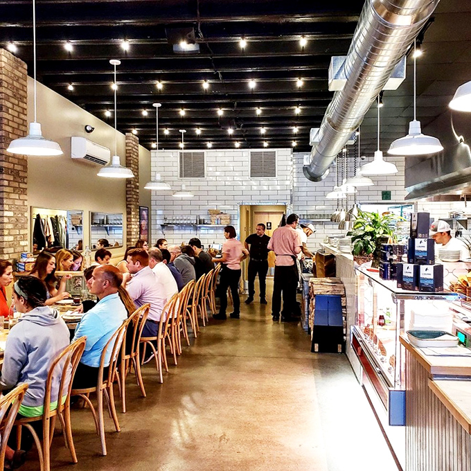 Green walls and industrial-chic vibes create the perfect backdrop for chicken that's about to change your life.