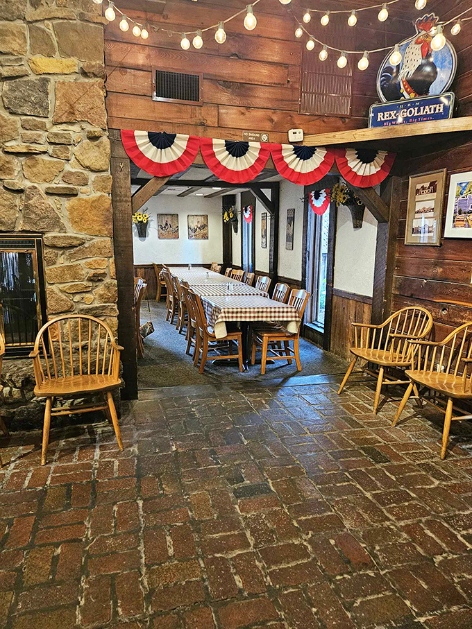 Rustic charm meets Americana in this dining room where every wooden beam tells a story. The checkered tablecloths practically whisper, "Sit down, stay awhile."