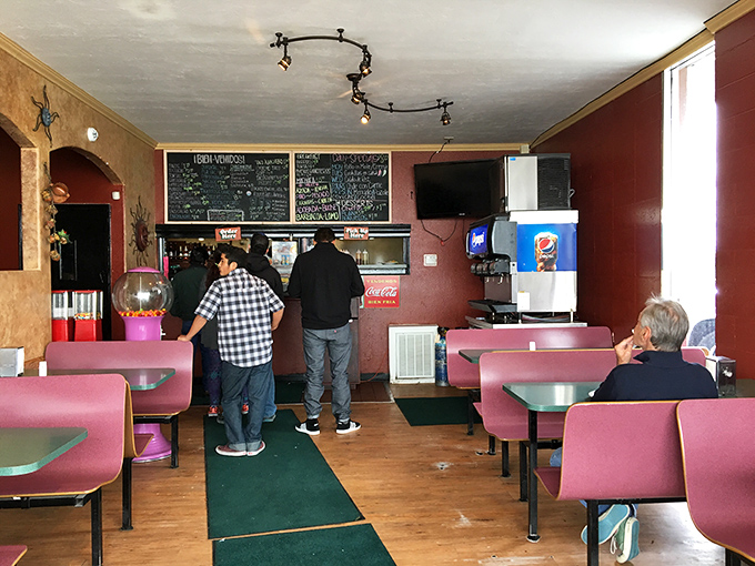 Pink vinyl booths and a chalkboard menu &ndash; nothing fancy here, just the universal language of "we're putting our energy into the food, not the furniture."