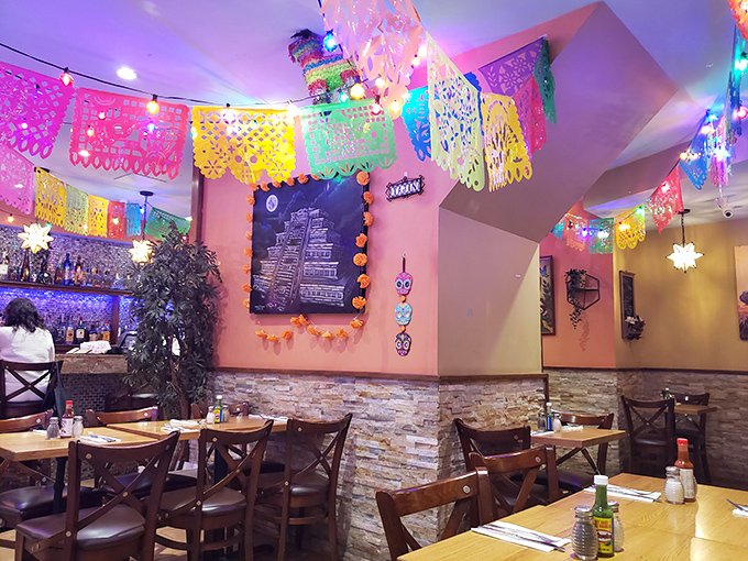 Step into a fiesta for the senses where papel picado banners create a ceiling of joy and stone accents ground the experience in rustic charm.