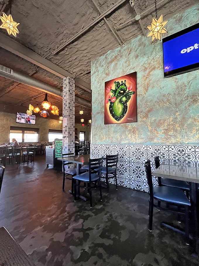 Industrial meets artisanal in Cielo's dining room, where star-shaped pendant lights dangle like celestial bodies above conversations about to be interrupted by fantastic food.