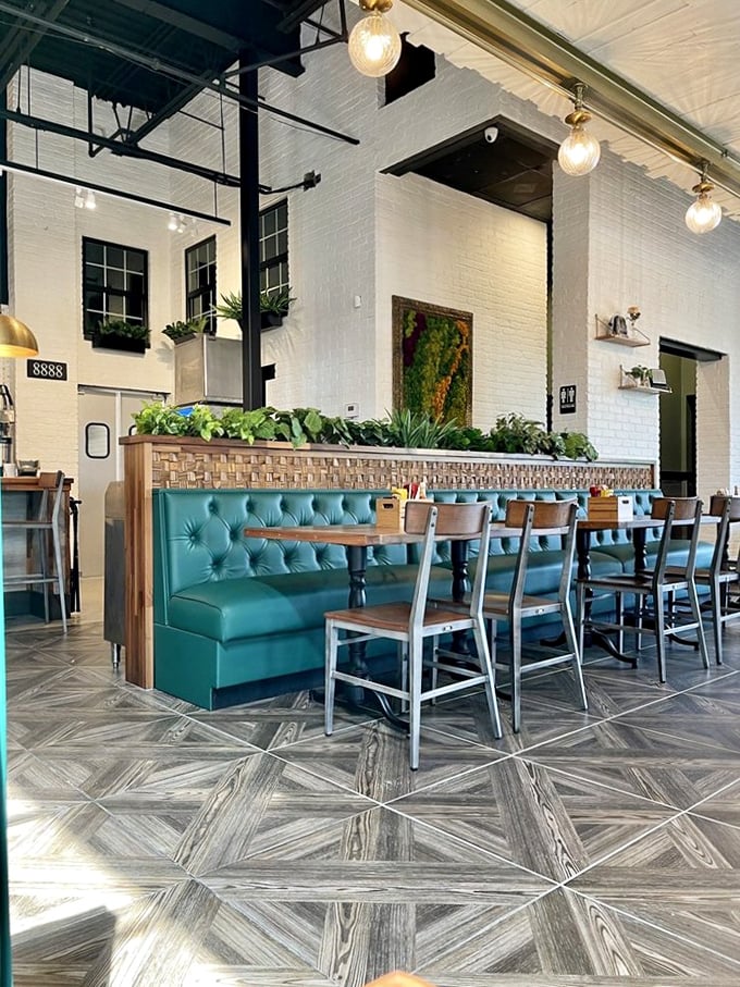 These teal booths aren't just Instagram bait; they're comfort command centers where breakfast dreams become delicious reality.