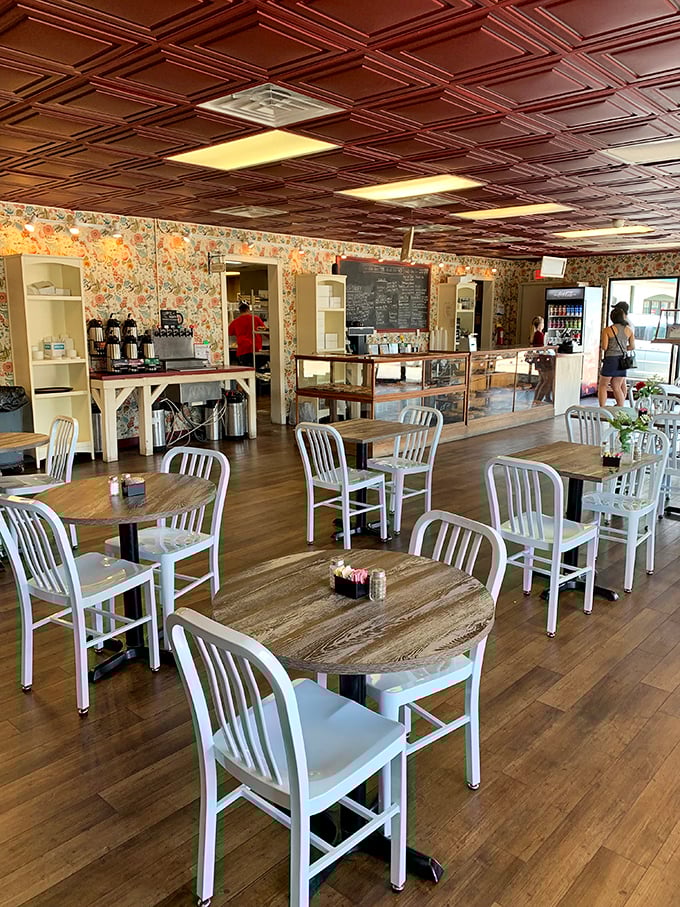 Warm wooden tables, cozy floral wallpaper, and that stunning copper ceiling create the perfect stage for pie-based happiness.