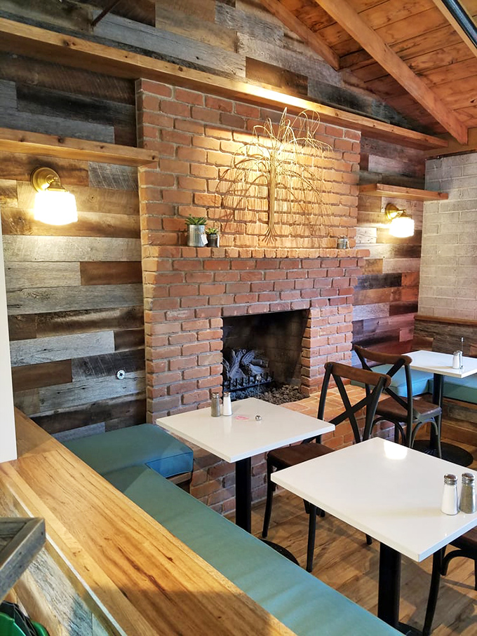 Rustic meets refined in this cozy interior where exposed brick and reclaimed wood create the perfect backdrop for morning conversations and coffee revelations.