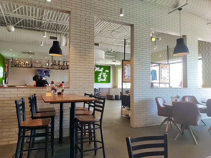 Clean lines, white brick walls, and that neon sign promising "Meet Me at Brunch"&mdash;this is where morning meals get their well-deserved glow-up. 