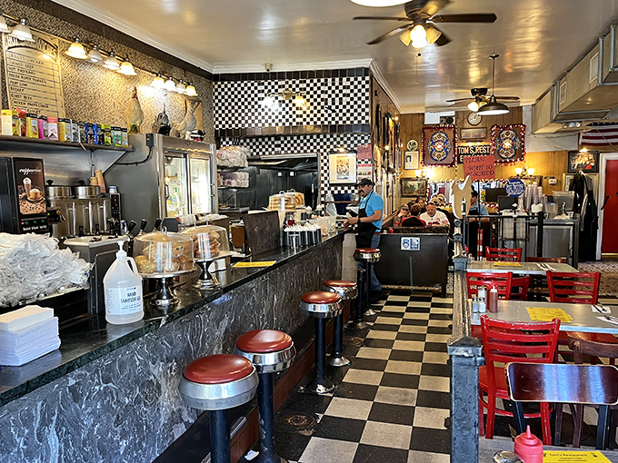 The checkered floor and counter stools aren't retro by design&mdash;they're authentic by survival, a time capsule where coffee refills are considered a constitutional right.
