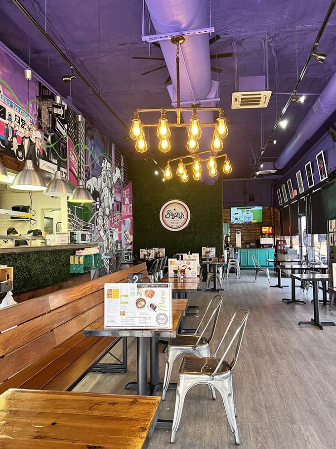 Edison bulbs illuminate wooden tables while metal chairs add industrial chic. It's like someone designed the perfect breakfast spot after binge-watching HGTV.