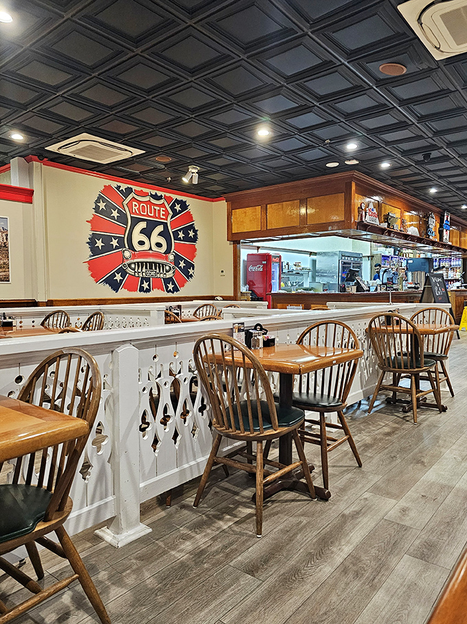 Classic Windsor chairs and vintage Route 66 memorabilia create the perfect backdrop for comfort food conversations. This isn't decoration&mdash;it's a full-blown time machine.