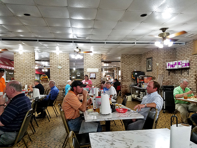 Inside, the buzz of conversation and clink of coffee mugs create the soundtrack to what real community looks like at mealtime.