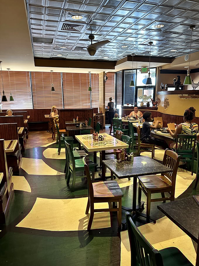 Where breakfast dreams come true. The warm wood paneling, tin ceiling, and swirling green floor create a diner atmosphere that feels like coming home.
