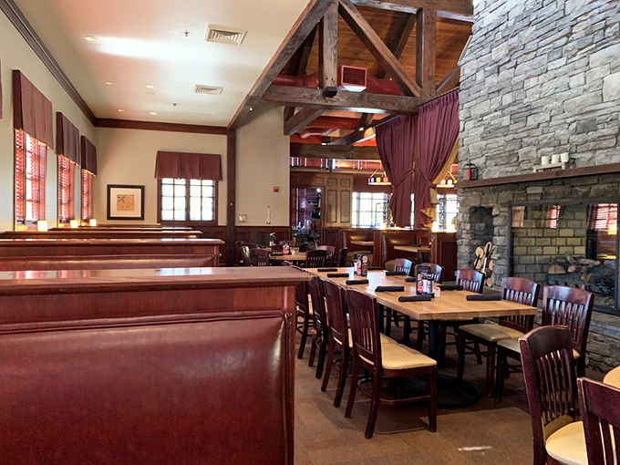 Exposed wooden beams, stone fireplace, and rich leather booths create that rare atmosphere where "upscale" and "comfortable" aren't mutually exclusive concepts.