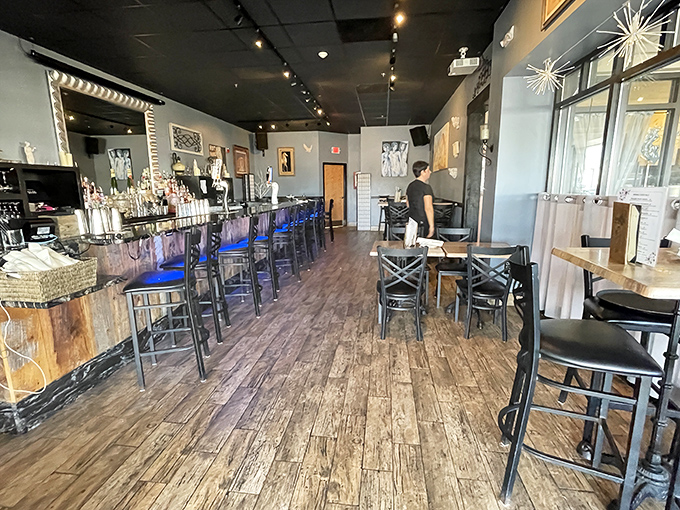 The warm wooden interior strikes that perfect balance between casual and charming, inviting you to linger over one more glass of wine.