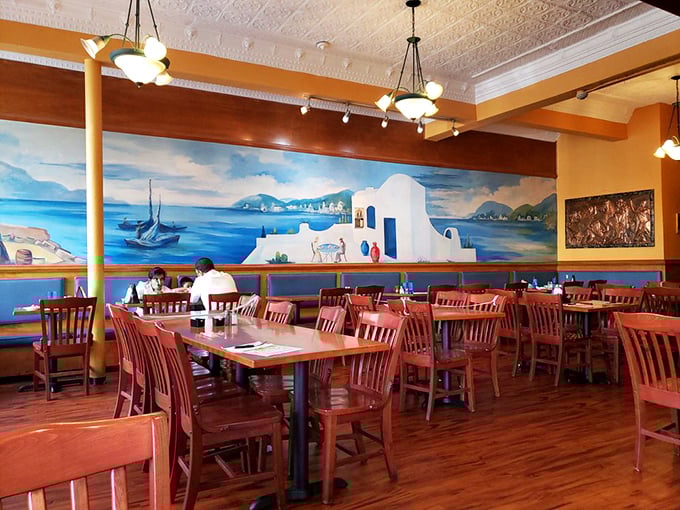 Step inside and you're transported straight to the Aegean. That mural isn't just decoration&mdash;it's a preview of the flavor vacation your taste buds are about to take.