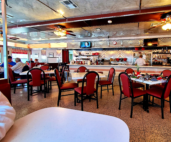 Inside, the pressed tin ceiling and red vinyl chairs create that perfect diner atmosphere where conversations flow as freely as the coffee.