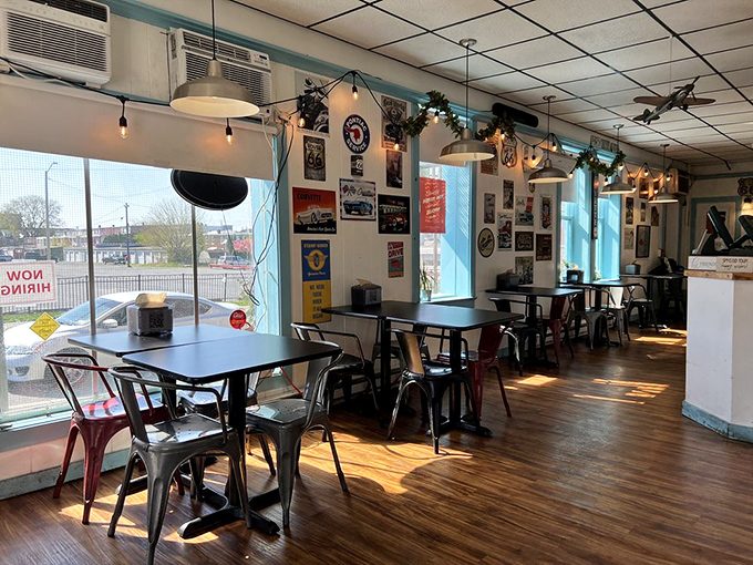Sunlight floods the dining room, illuminating decades of automotive nostalgia and memorabilia while model planes keep watch from above.
