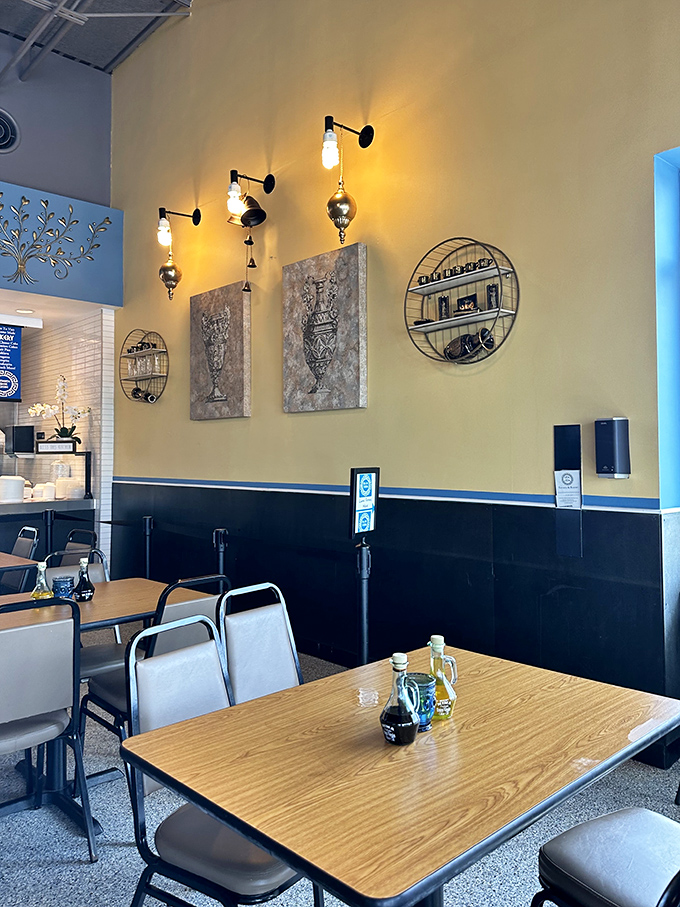 Blue and yellow walls adorned with Mediterranean-inspired art create that perfect "I'm on vacation" atmosphere, even when you're just on your lunch break.