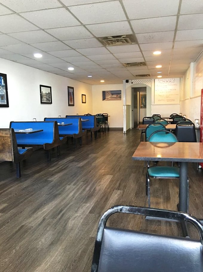 Simple blue booths and wooden tables create an unpretentious dining room where the food, not the decor, takes center stage.