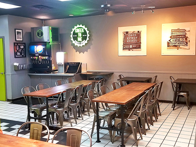 Industrial-chic meets Grecian comfort in this no-frills dining room where wooden tables and metal chairs set the stage for flavor, not fashion.