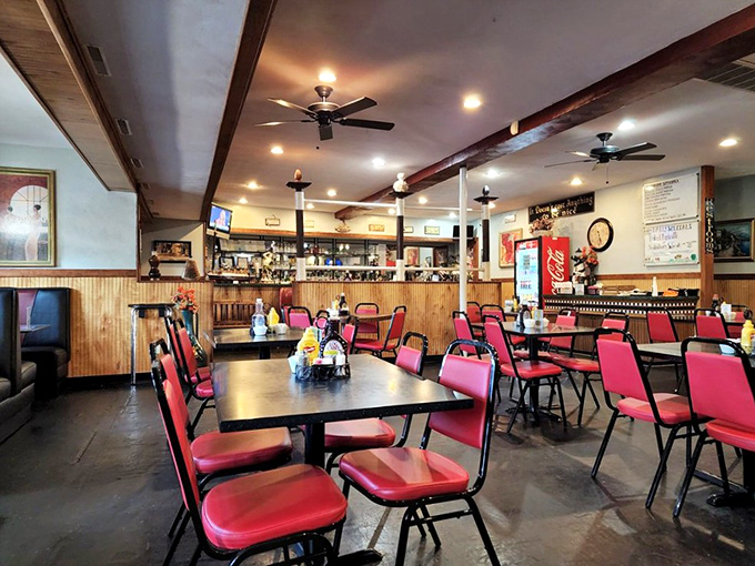 Red vinyl chairs and wood paneling create that classic diner atmosphere where calories don't count and coffee refills are practically mandatory.