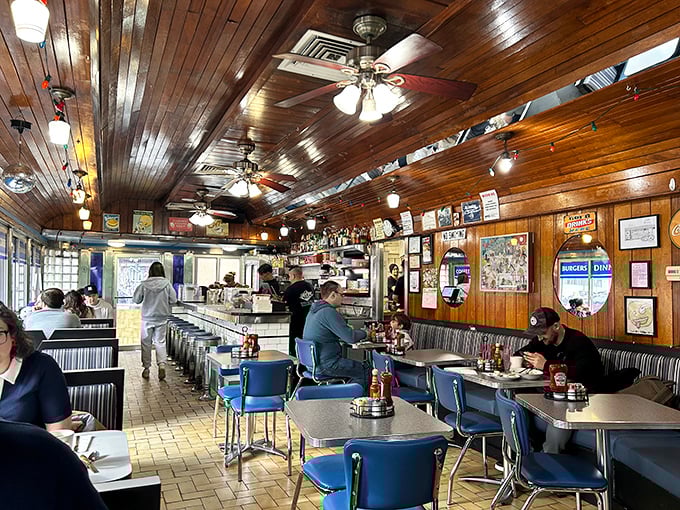 Wooden ceiling panels, vintage booths, and ceiling fans spinning lazily overhead&mdash;this isn't just a diner, it's a time machine with coffee service.