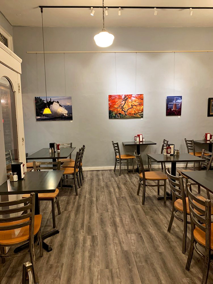 Inside, local photography adorns walls while simple wooden chairs invite you to linger. Comfort doesn't need to be complicated.