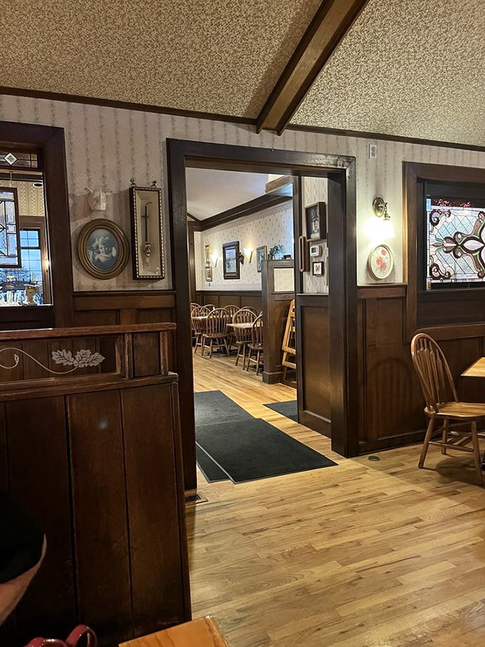 Step inside and feel the warmth. The Oak Table's wood-paneled interior with Windsor chairs creates that perfect "grandma's country home" vibe we all secretly crave.