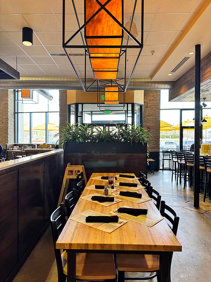 Modern meets cozy with these geometric light fixtures and wooden tables. It's like your stylish friend's kitchen, if your friend could cook for 100.