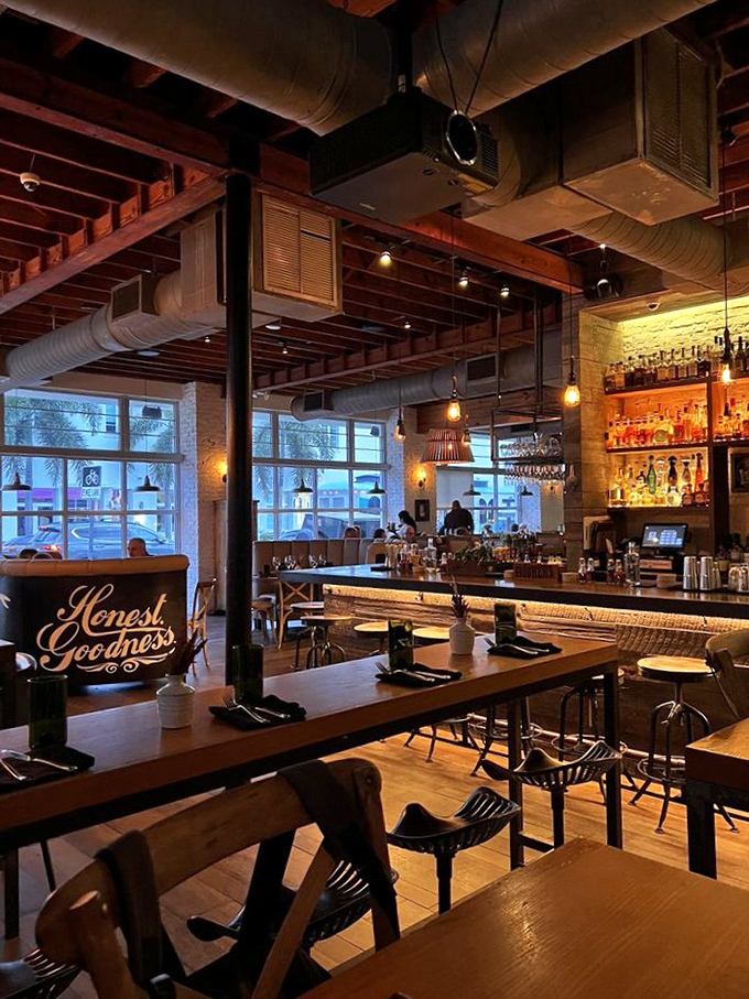 "Honest Goodness" isn't just a sign—it's a promise. Exposed beams, Edison bulbs, and that bourbon collection would make even Don Draper swoon.