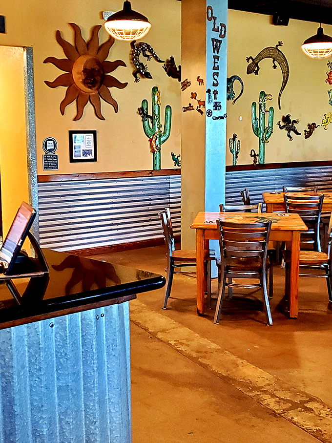Southwestern charm meets breakfast paradise with metal cacti, lizard sculptures, and that smiling sun watching over your meal like a benevolent breakfast deity.