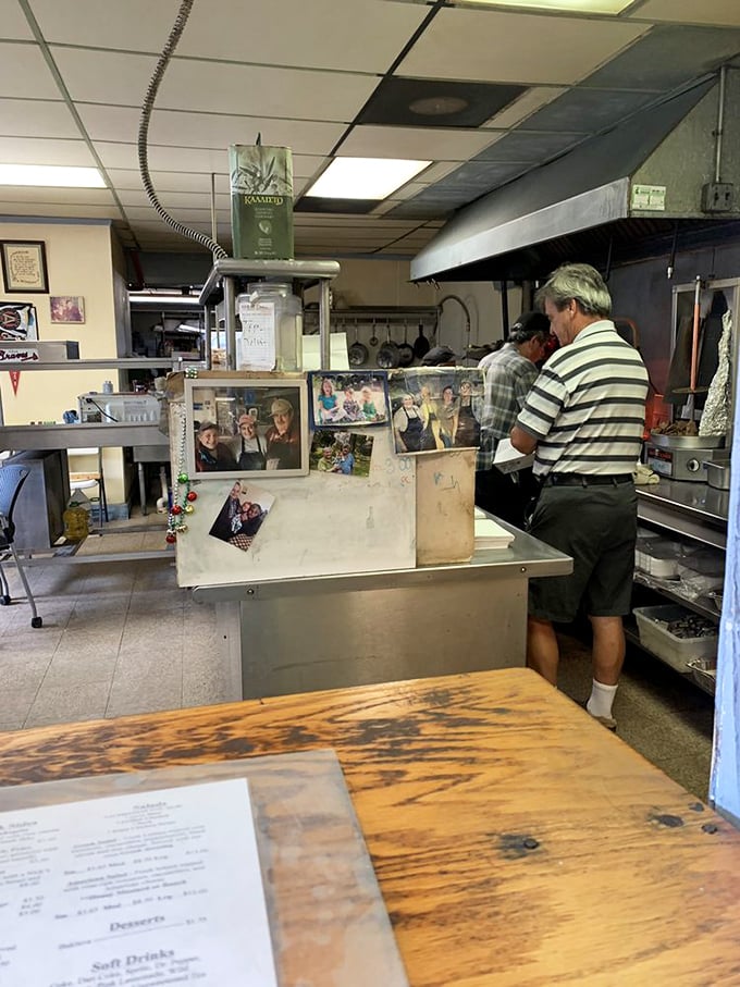 Behind the counter, culinary magic happens with methodical precision. Family photos tell the story that the menu can't&mdash;this place is built on tradition, not trends.