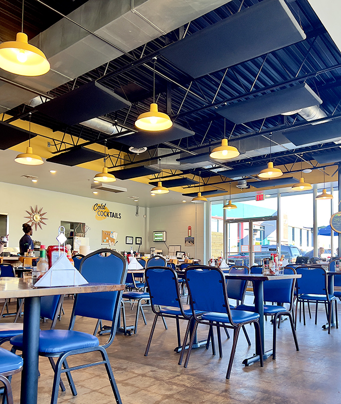 Modern industrial meets classic diner comfort with those signature blue chairs&mdash;like your favorite booth got a HGTV makeover.