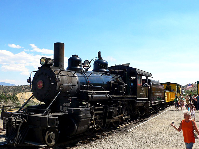 All aboard for a journey back in time! The Virginia & Truckee Railroad's vintage steam engine awaits passengers for a ride through Comstock history.