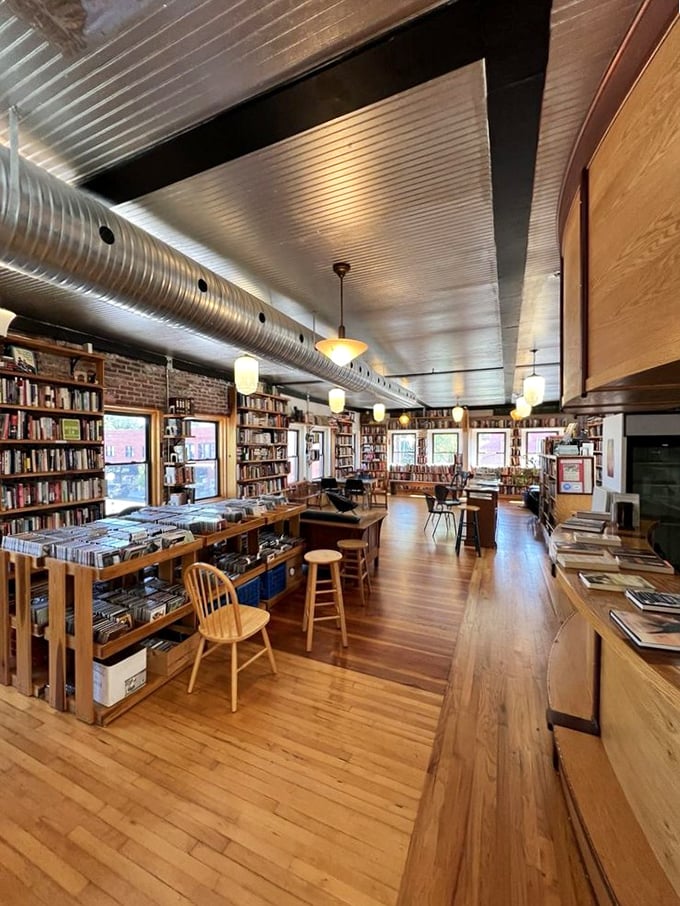 Warm wooden floors, exposed brick, and pendant lighting create the perfect atmosphere for literary exploration. Even the ventilation duct seems to whisper stories.
