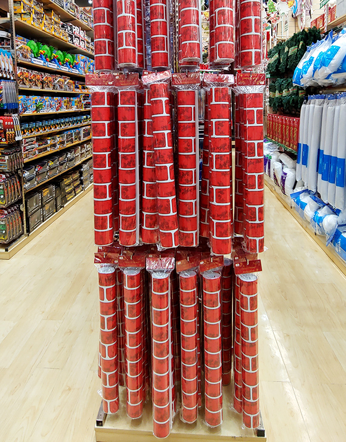 These festive brick-patterned rolls aren't building materials&mdash;they're wrapping paper towers standing like sentinels of seasonal savings in the holiday aisle.