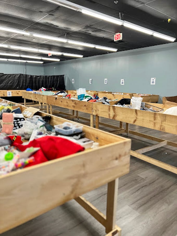 Wooden bins await eager hands of bargain hunters. It's like archaeological digging, except instead of dinosaur bones, you might unearth a brand-new blender.