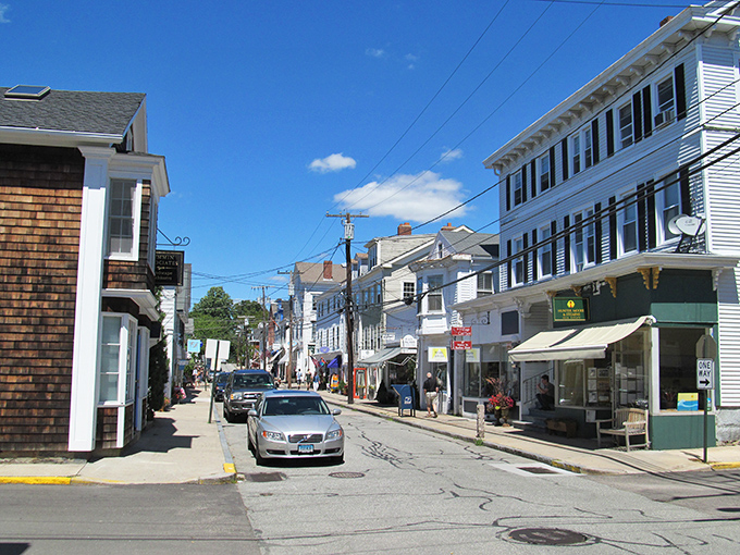 Water Street buzzes with small-town energy under impossibly blue skies, where locals and visitors mingle without pretension.