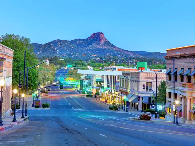 Thumb Butte stands guard over Prescott at twilight, when the historic buildings glow with the promise of evening entertainment.