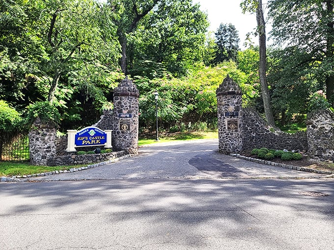 Stone pillars guard the entrance like sentinels from another era, welcoming modern-day explorers to this hidden gem in Essex County.