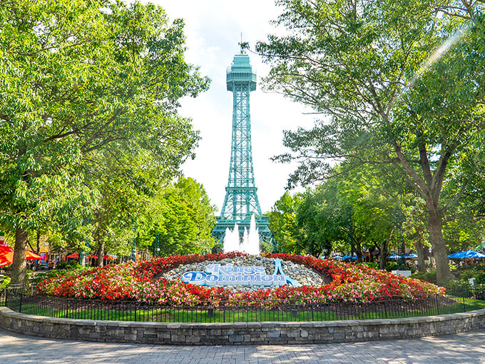 The iconic Eiffel Tower replica stands sentinel over meticulously maintained gardens, welcoming visitors to Virginia's slice of Parisian charm.