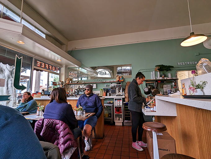 Where mint green walls and cozy quarters turn strangers into temporary breakfast companions. Personal space is overrated anyway.