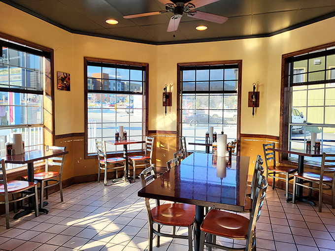 Sunlight streams through large windows, illuminating wooden tables where countless BBQ dreams have come true and diets have gloriously failed.