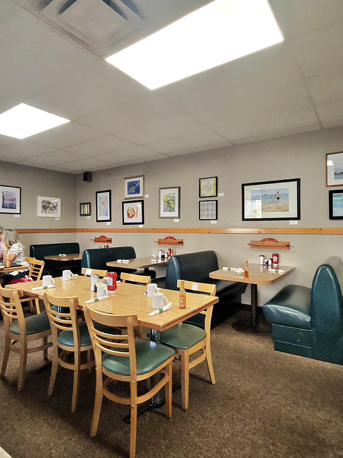 Classic diner aesthetics meet local art in this cozy dining room where conversations flow as freely as the coffee. Comfort never goes out of style.